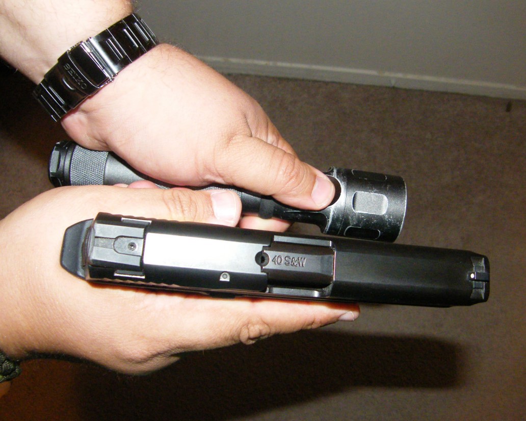 How to Use a Handheld Light with a Firearm - Survival Dispatch