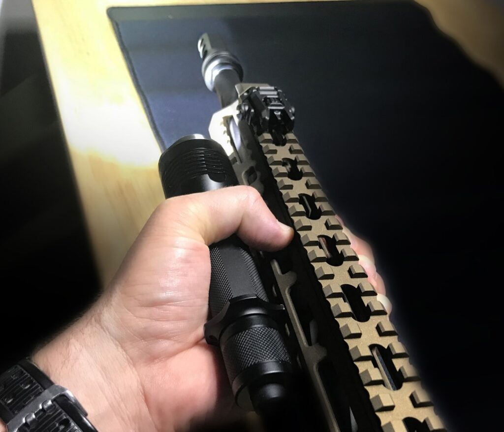 How to Use a Handheld Light with a Firearm - Survival Dispatch